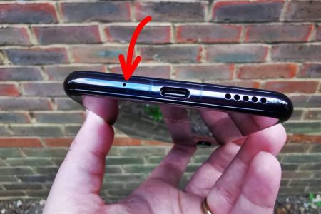 What is the small hole next to your phone’s charging port and why ...